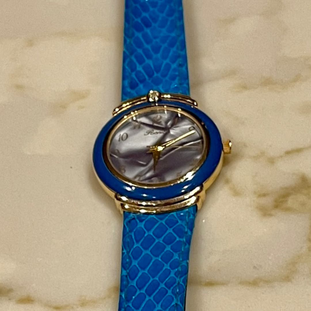 Gold Tone Watch W/ Blue Ring, Crystal at 12, Marbleized Face, Blue ...
