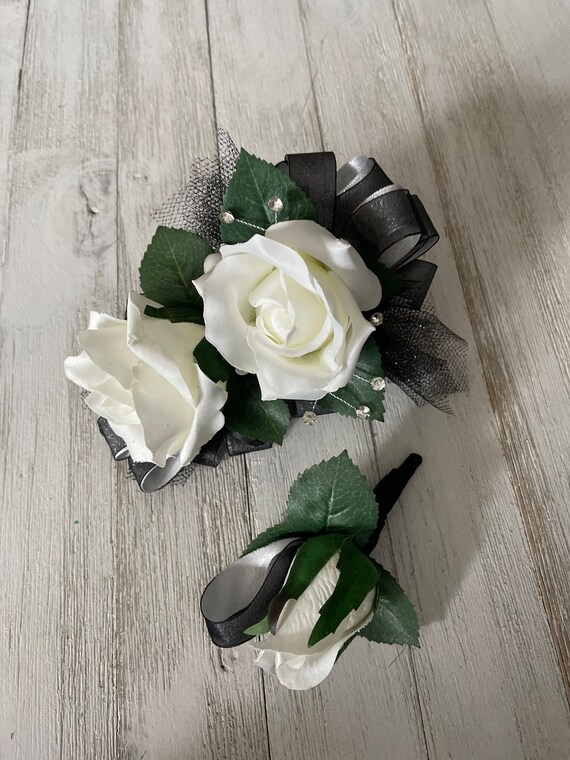 Wrist corsage and matching boutonniere in white roses with black and silver trim READY TO SHIP