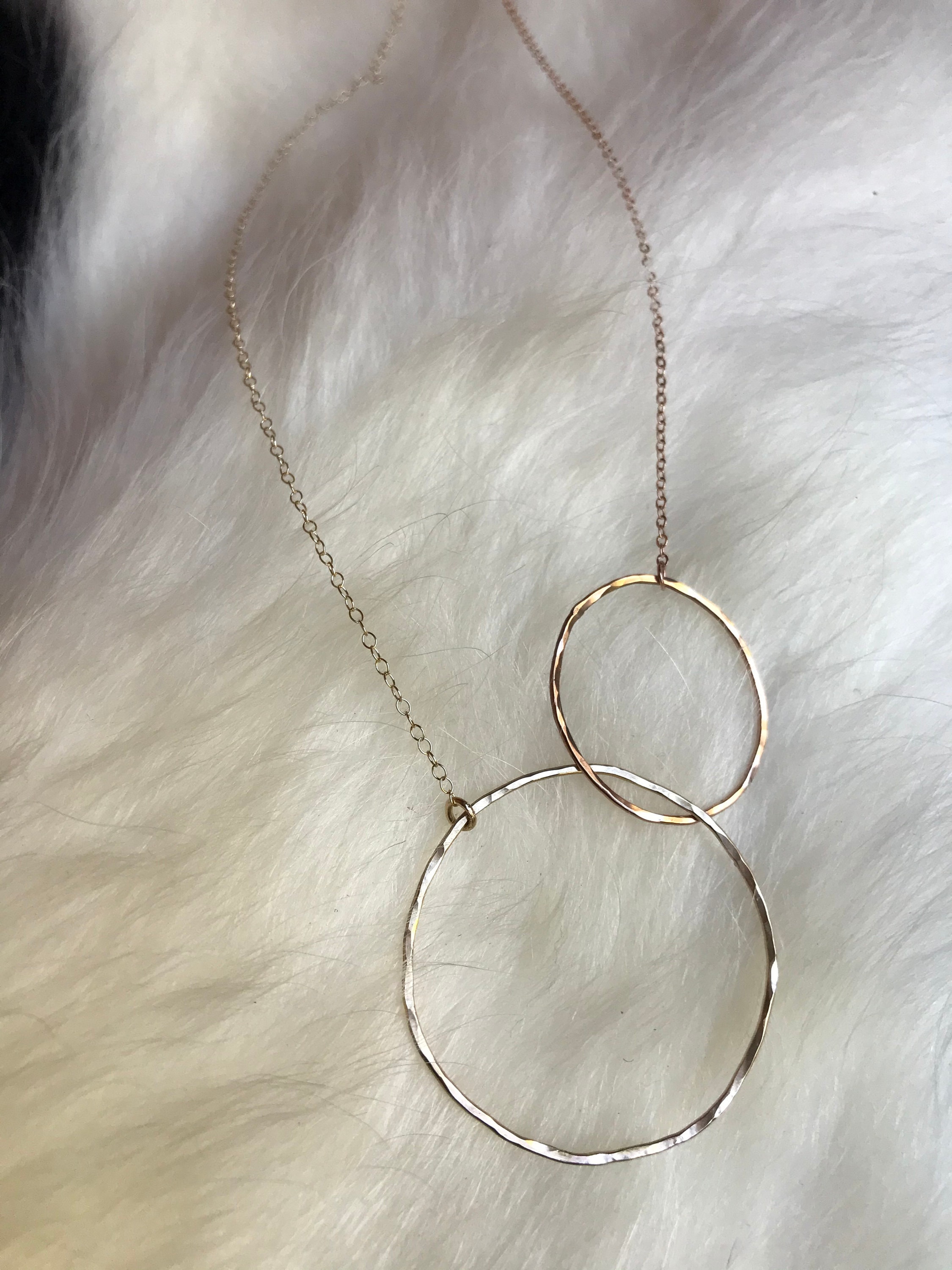 The Lydia necklace is two interlocking circles, one 14k gold fill and ...