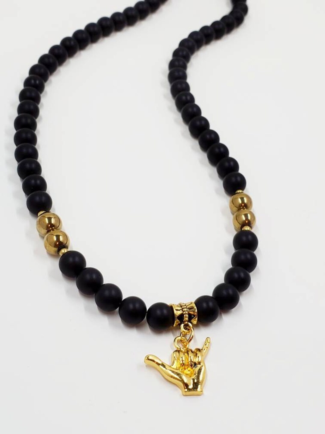 Black and Gold Hand Sign Necklace - Etsy