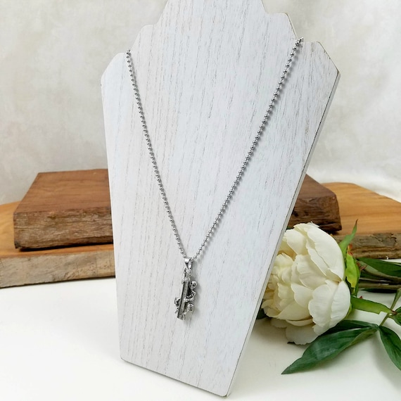 Skeleton Hugging Cross Pendant, Chisel Stainless Stee… - Gem