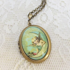 Angel Locket Angel on Moon Locket Art Glass Locket Large Oval Photo ...