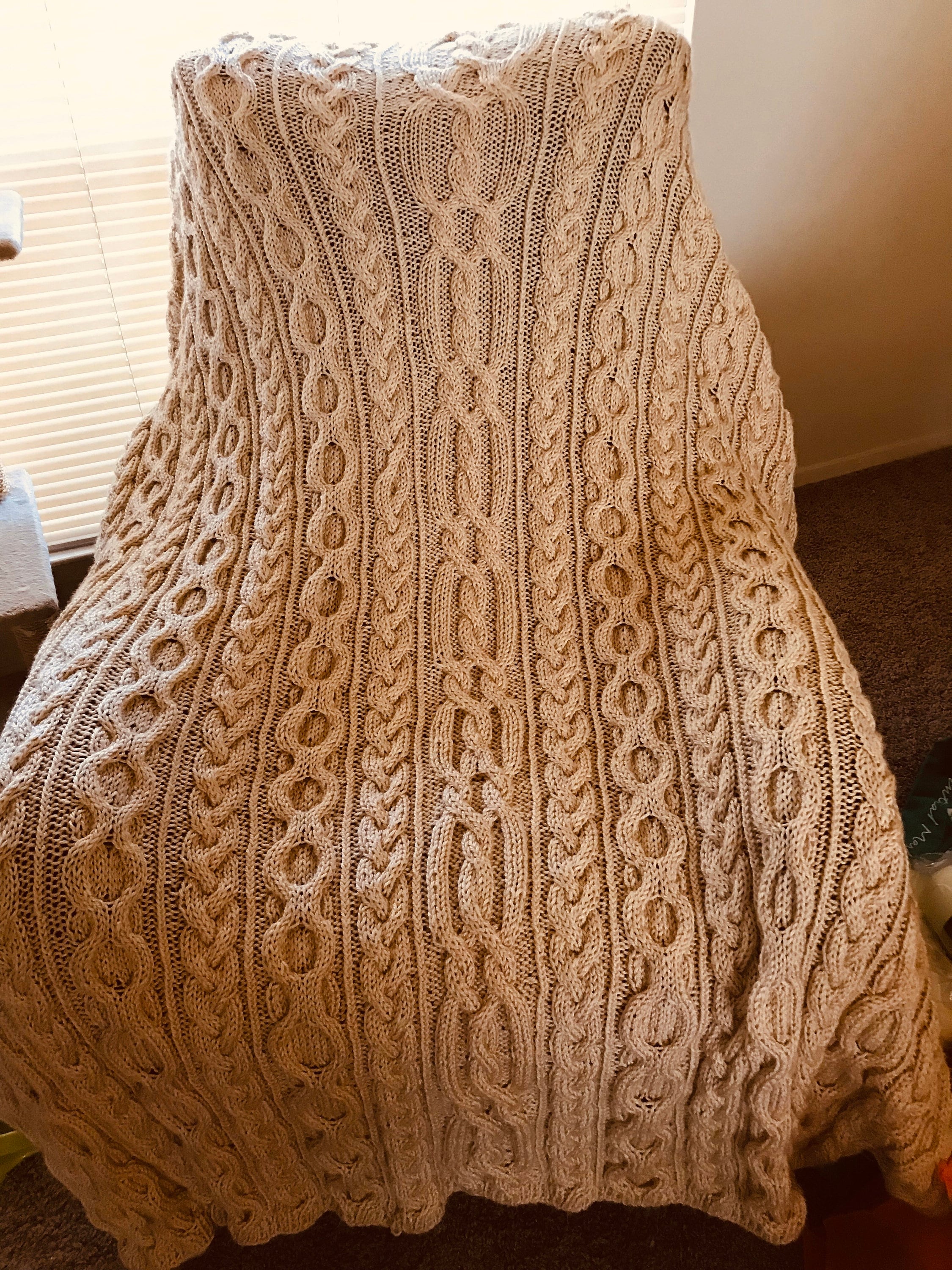 Knitted cable afghan