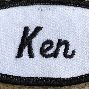 Ken, an off White Oval Work Shirt Name Patch That Says "ken" in Black ...