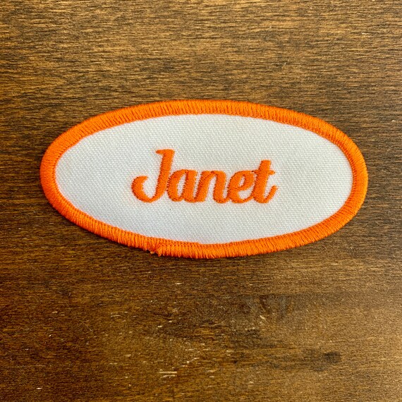 Janet. A white work shirt patch that says "Janet" in … - Gem