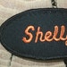 Shelly. A Black Work Shirt Name Patch That Says shelly in Orange Script ...