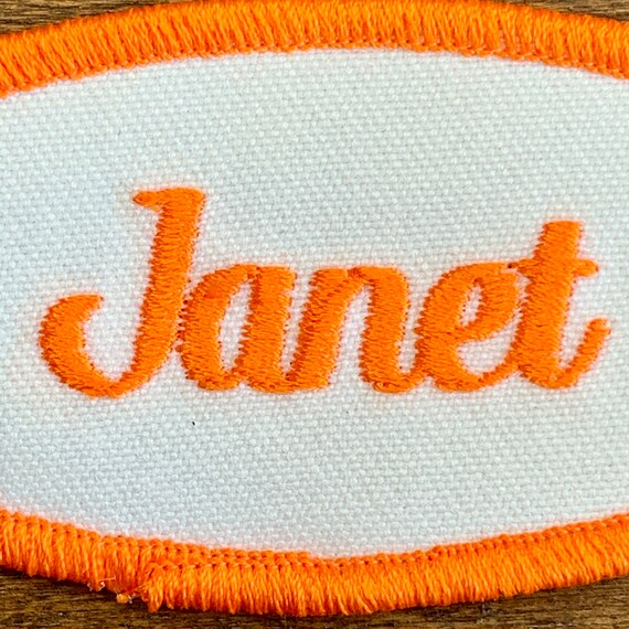 Janet. A white work shirt patch that says "Janet" in … - Gem