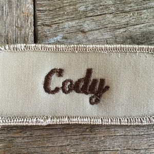 Cody. A Metallic Tan Work Shirt Name Patch That Says cody in Brown ...