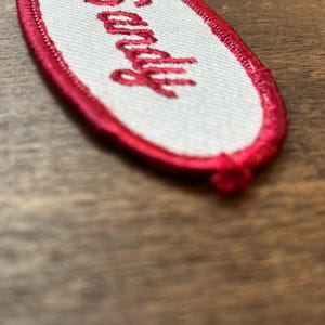 Sandy A White Work Shirt Name Patch That Says sandy in Red Script With Red Border. Note Defect ...
