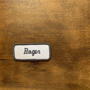 Roger. A White Work Shirt Name Patch That Says roger in Gray Script ...