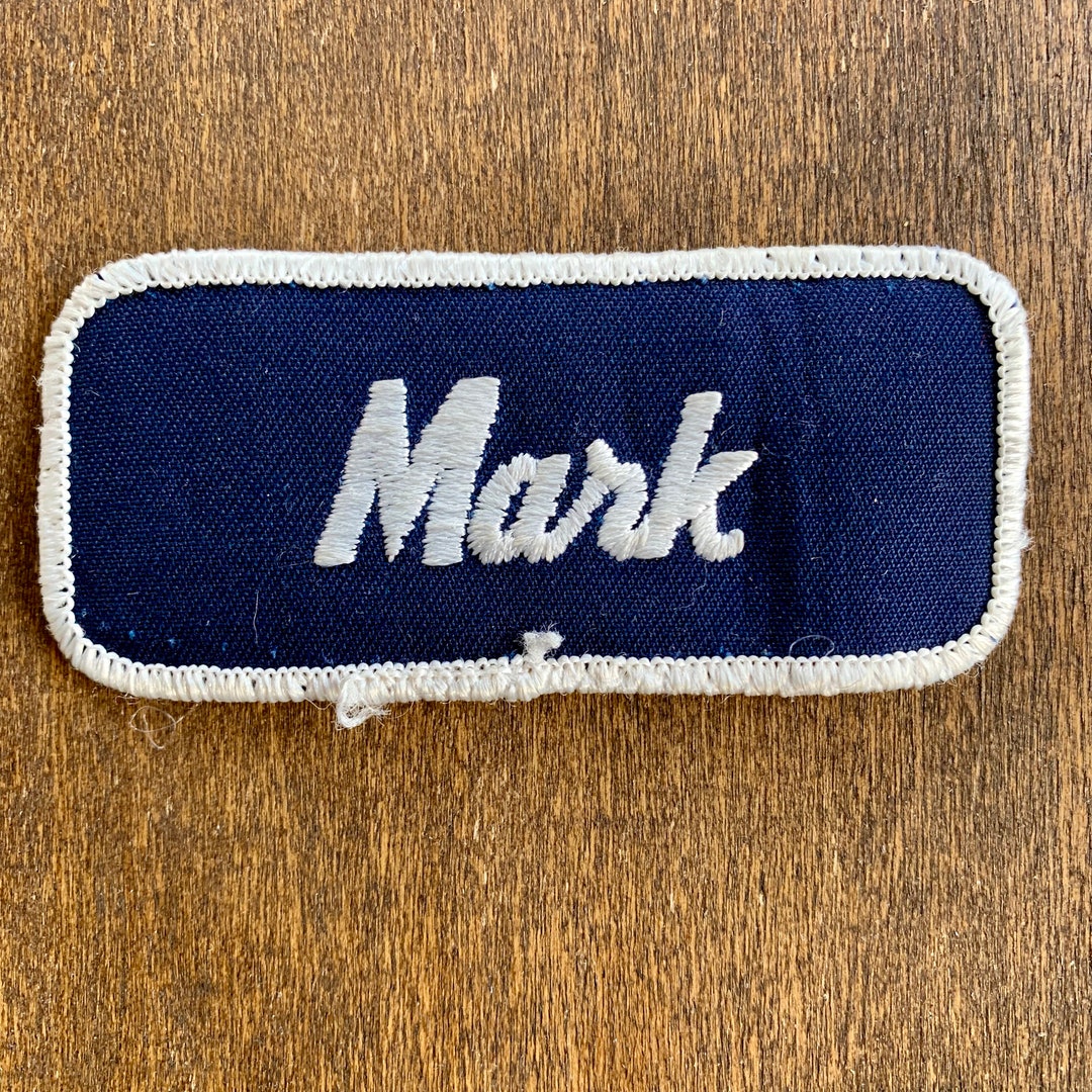 Mark. A Blue Work Shirt Name Patch That Says "mark" in White Script ...