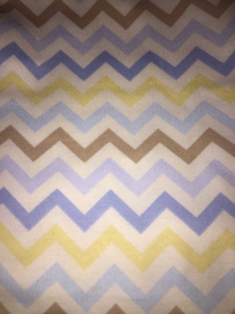 This Sheet is a Chevron Print in Blues and Tan on White Background ...
