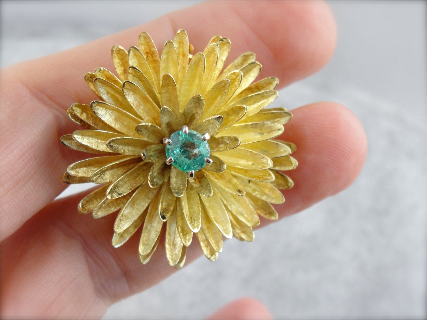 Flower Brooch With Bright Emerald Center, Textured High Karat Yellow ...