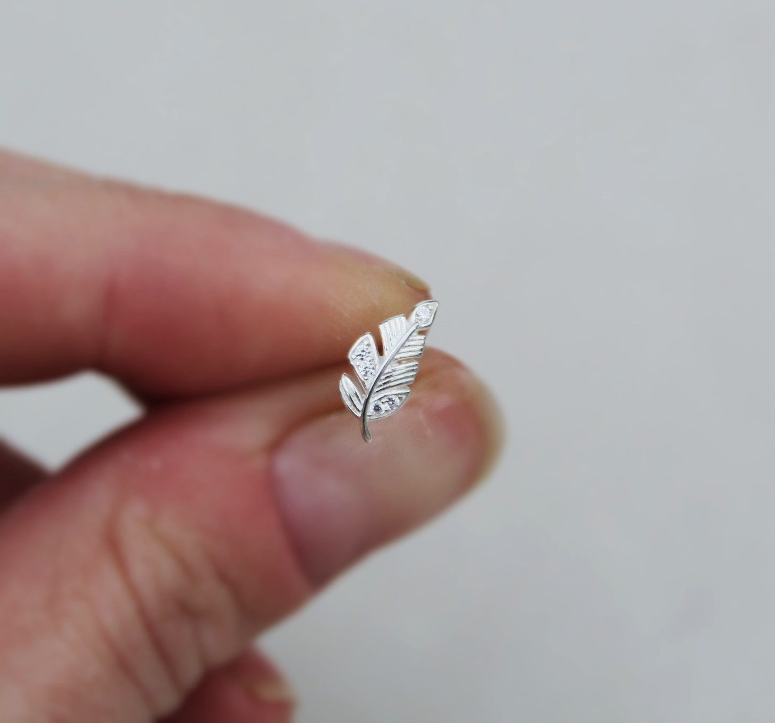 Tiny silver feather stud tiny silver stud cz leaf earrings | Etsy