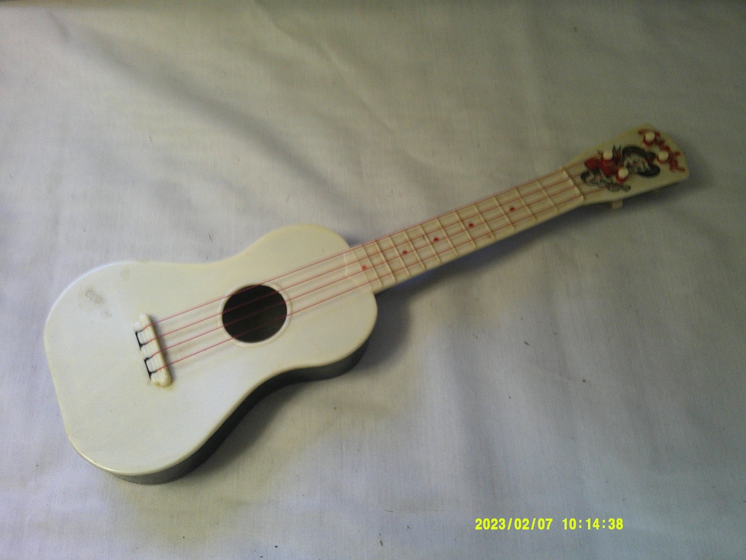 Vintage 1970s Carnival Ukulele Plastic, 4 Strings. Cowboy Playing the ...