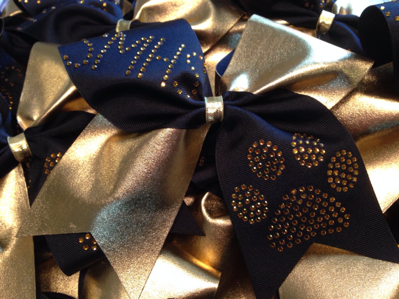 High School team cheer bow black and gold with rhinestone paw | Etsy