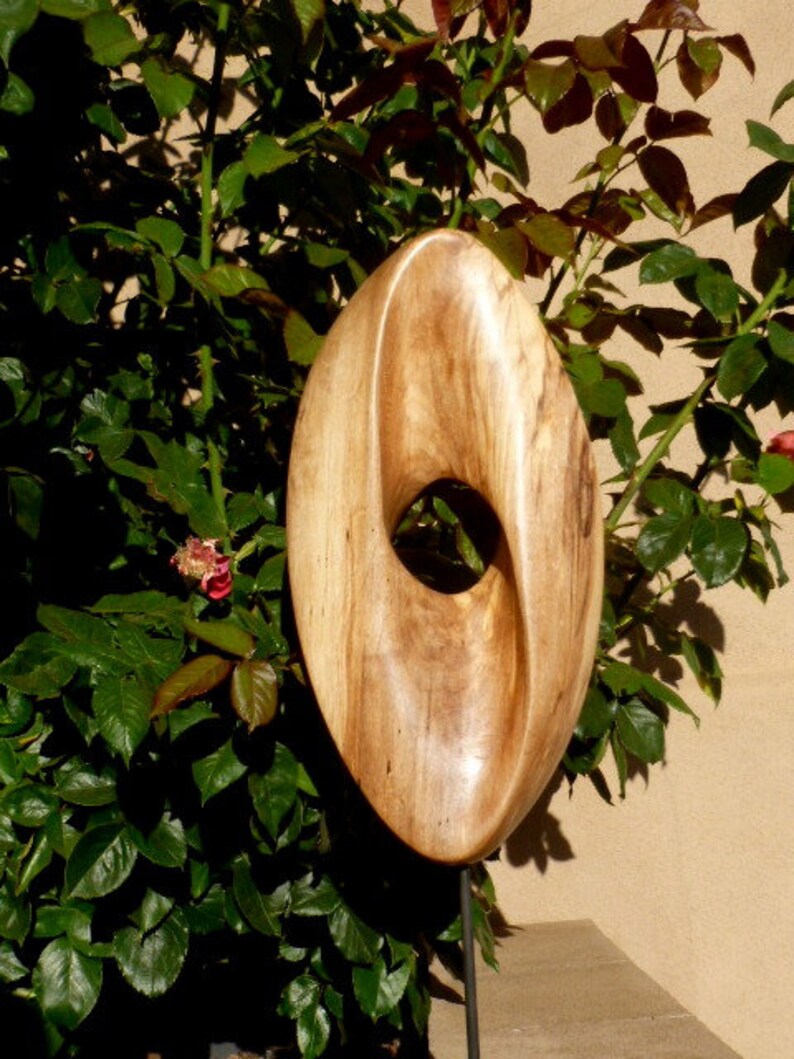 Large Mobius Strip. Oval Eye hand carved vertically mounted | Etsy