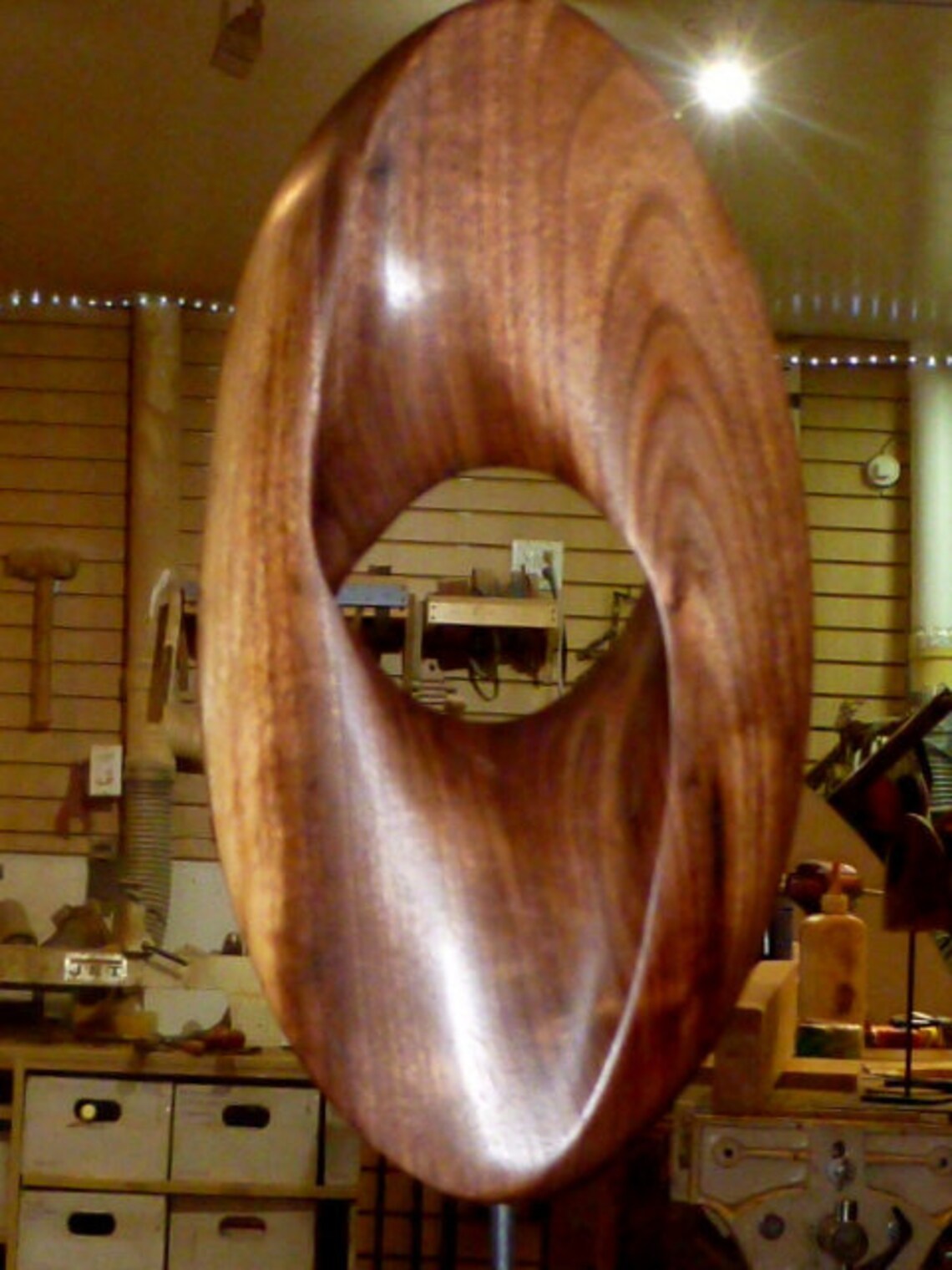Large Mobius Strip. Oval Eye hand carved vertically mounted | Etsy