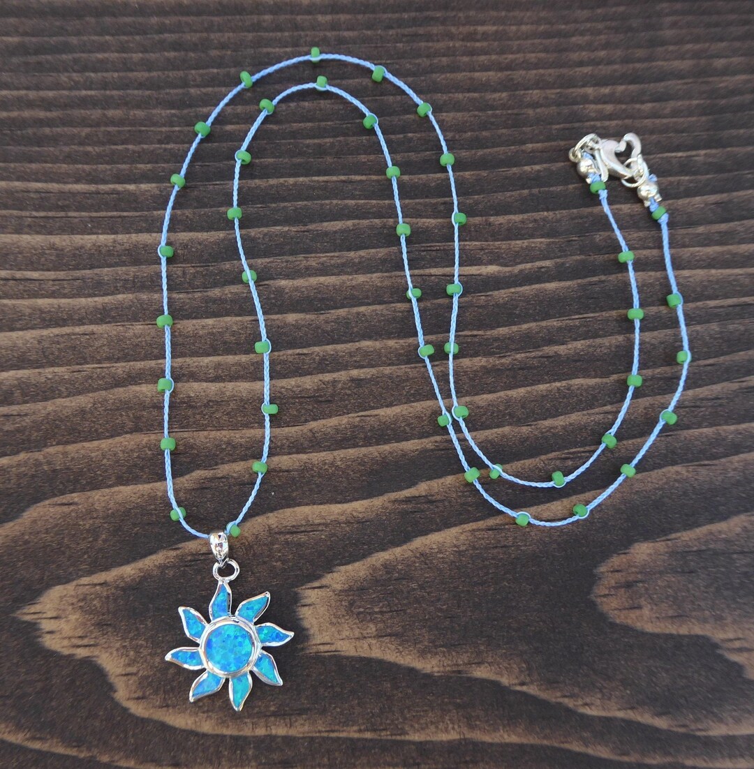 Woven Blue Cord Necklace With Green Fulani Beads and a Blue Opal Sun ...