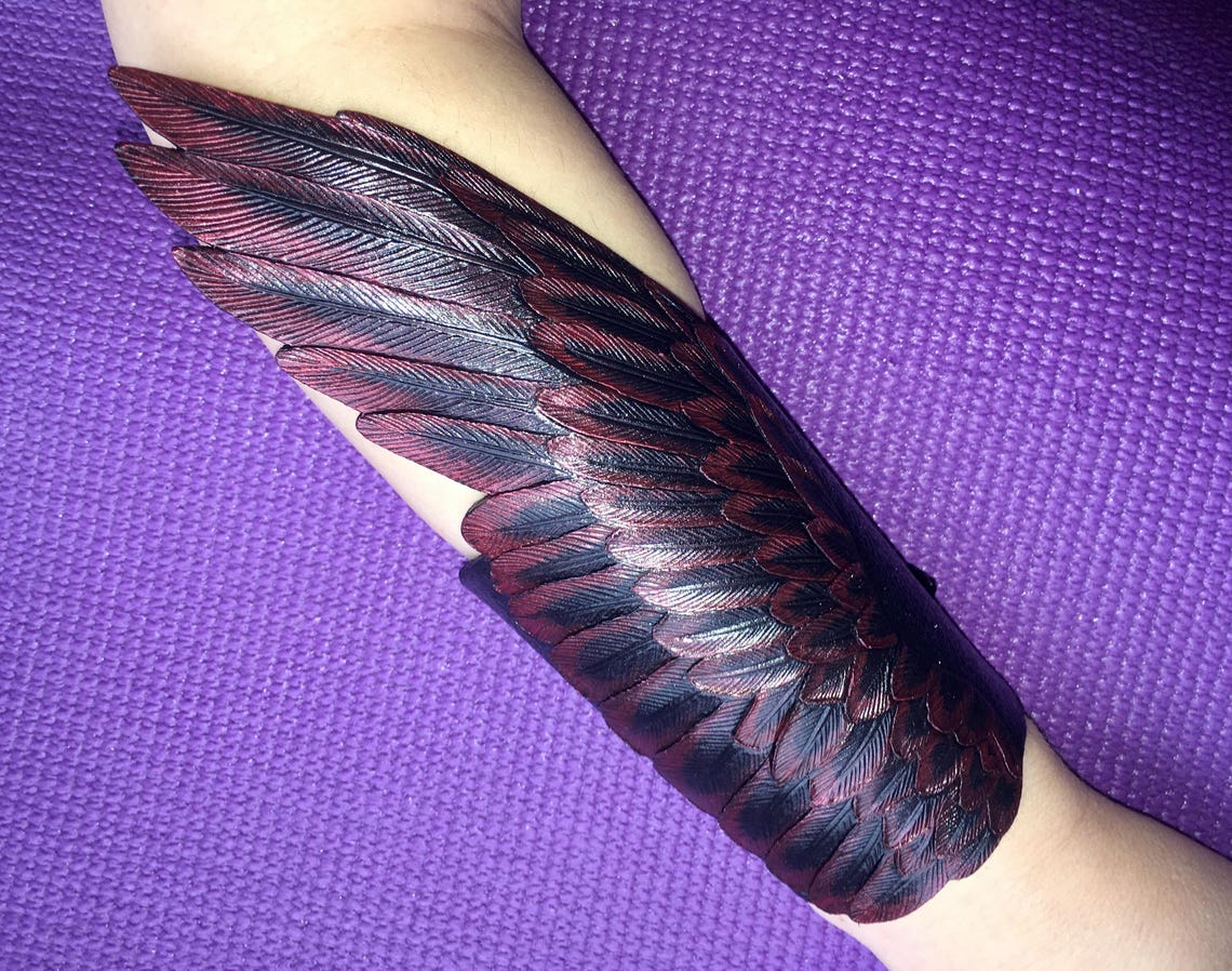 Tooled leather wing cuff with red iridescent sheen Tooled | Etsy