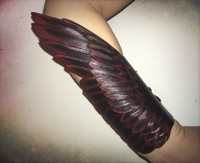 Tooled leather wing cuff with red iridescent sheen Tooled | Etsy