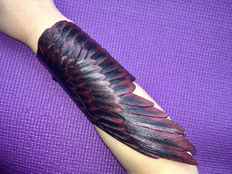 Tooled leather wing cuff with red iridescent sheen Tooled | Etsy