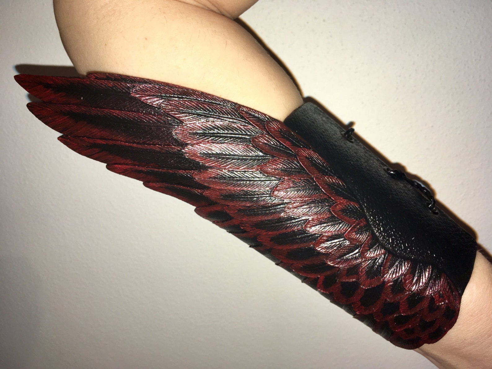 Tooled leather wing cuff with red iridescent sheen Tooled | Etsy