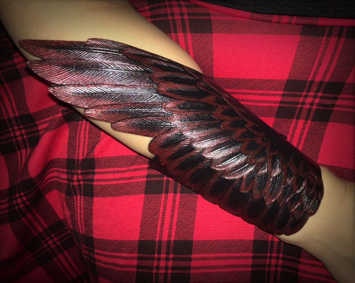 Tooled leather wing cuff with red iridescent sheen Tooled | Etsy