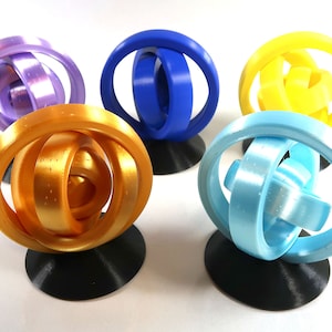 3D Printed FIDGET ROTARY Ring Toy With Free Stand OVER 25 Colors - Etsy