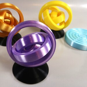 3D Printed FIDGET ROTARY Ring Toy With Free Stand OVER 25 Colors - Etsy