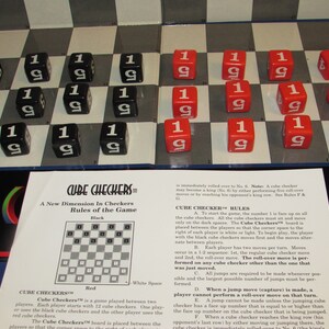 CUBE CHECKERS Game 1998 A New Dimension in Cube Checkers DEP Games ...