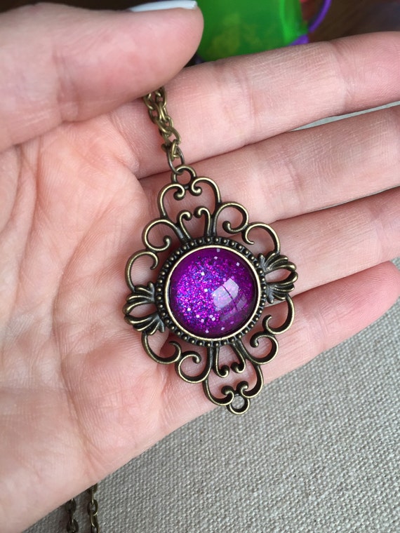 Items similar to Bright Purple Glitter Filigree pendant on Etsy