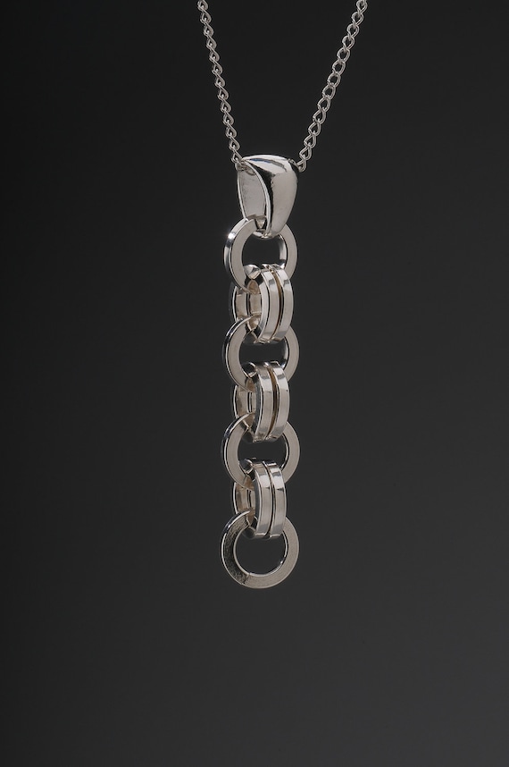 Four Ring Pendant in Sterling Silver | Etsy