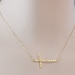 Cross Necklace. Kelly Ripa's Skinny Hammered Sideways Cross Necklace ...