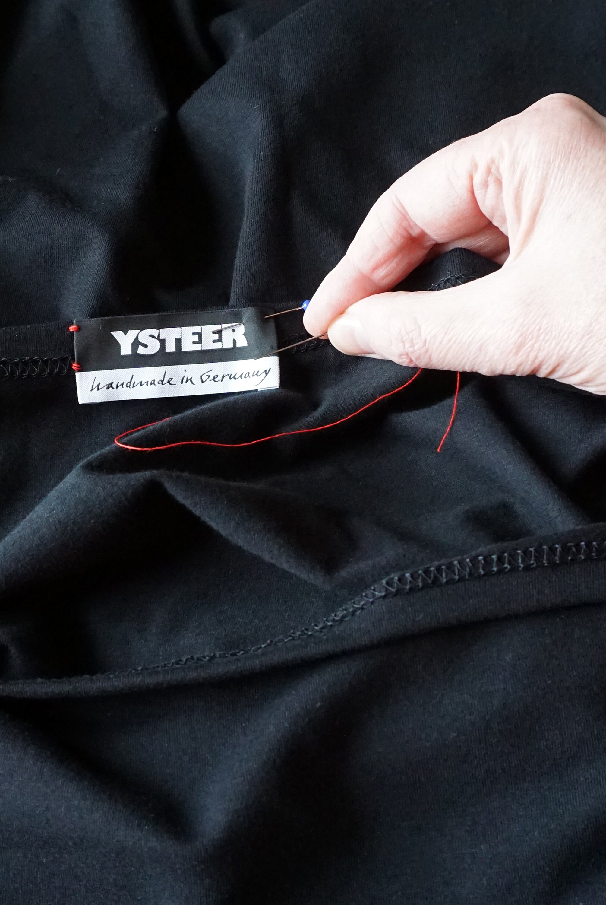 JACKET with overlapping shoulders, concealed closure