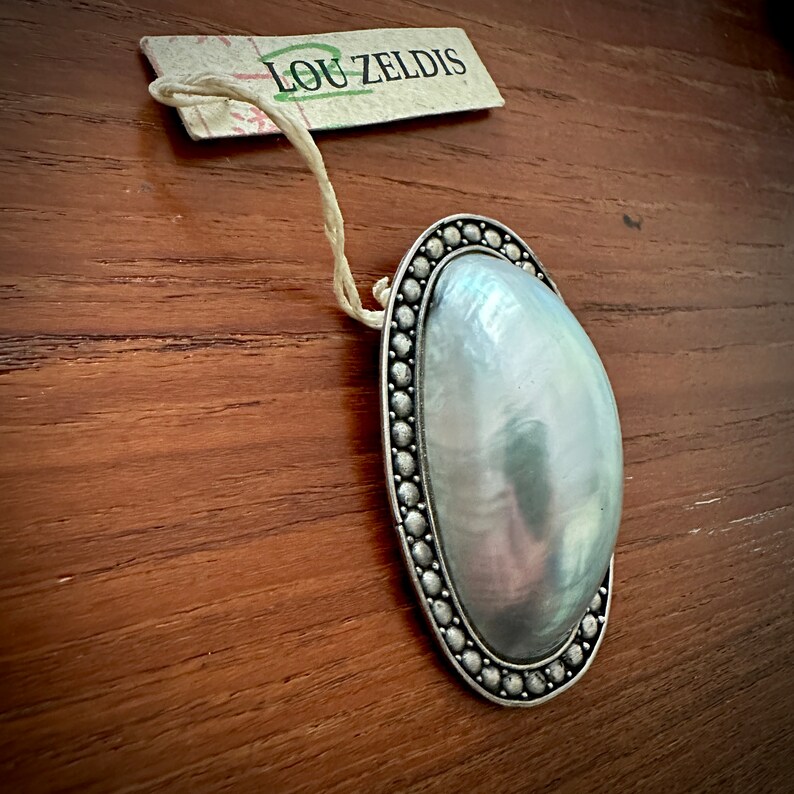 From the Lou Zeldis Collection... Mother of Pearl and Sterling Silver ...