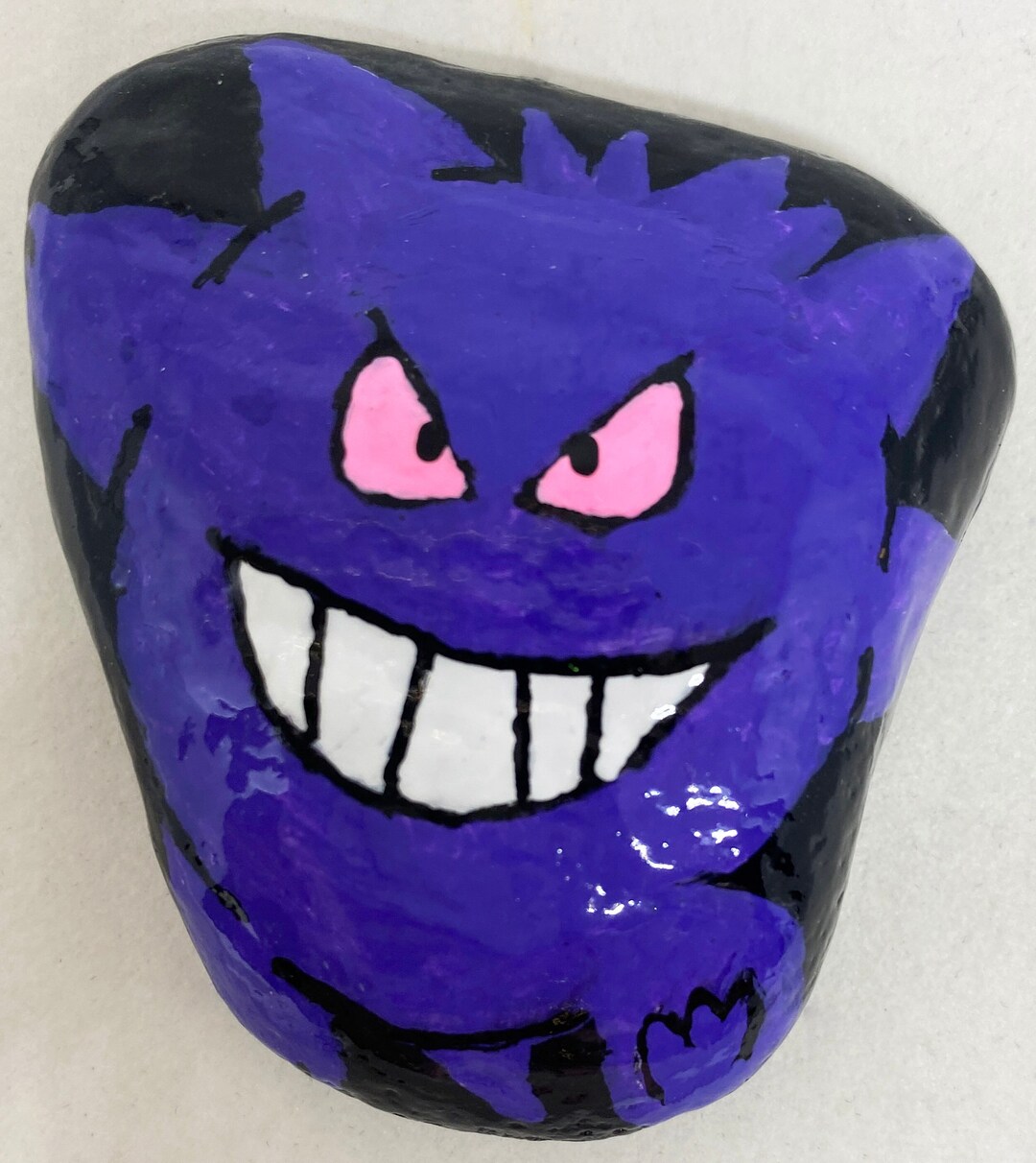 This Purple and Black Pokémon #94, is Gengar; He is in the Ghost/poison ...