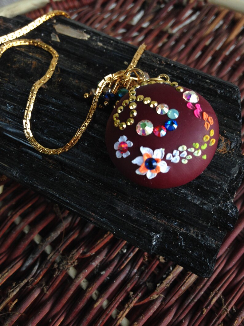 Deep Red Handmade Pendant With White Flowers, Crystal, and Gold Colored ...