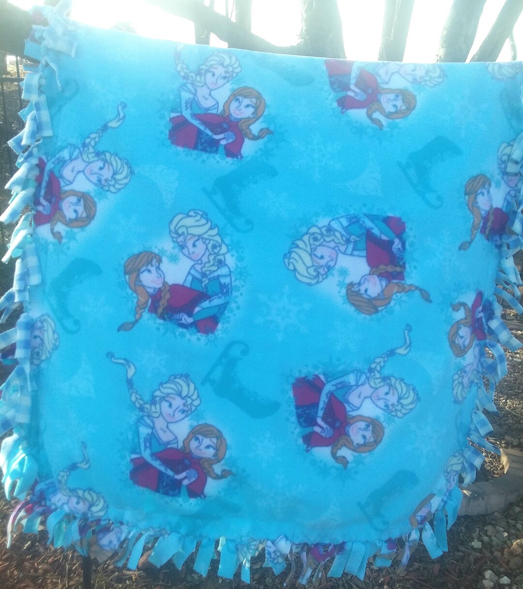 Frozen Toddler Throw. Size is 42"l X 35"w. the Design is Images of Elsa ...