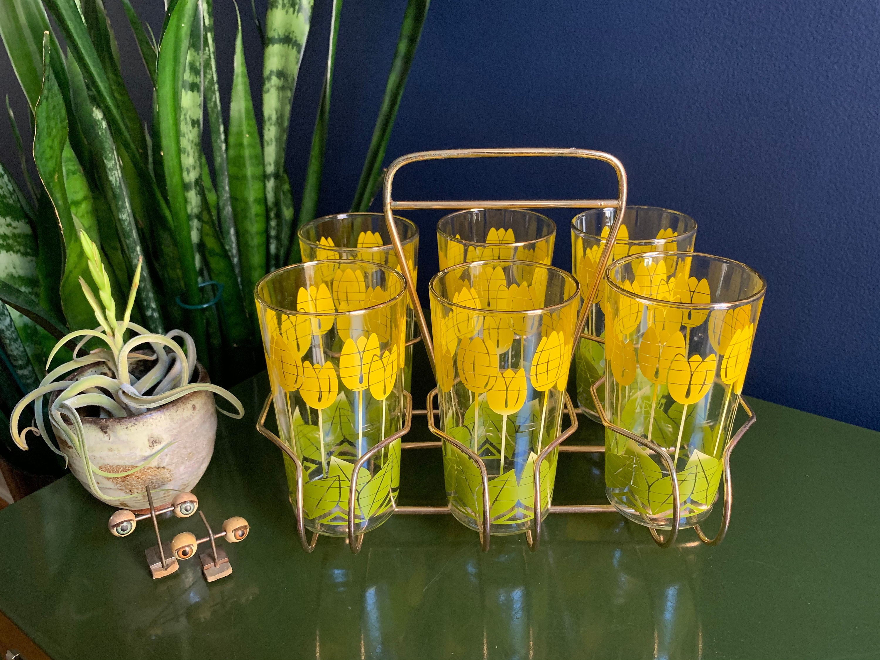 Mid Century Cocktail Glasses With Yellow Tulips, Gold Rims, And Brass Caddy
