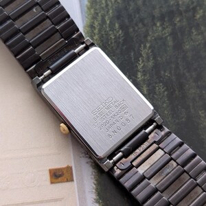 Vintage SEIKO Black and Gold Piano Dial Quartz Watch With New Battery ...