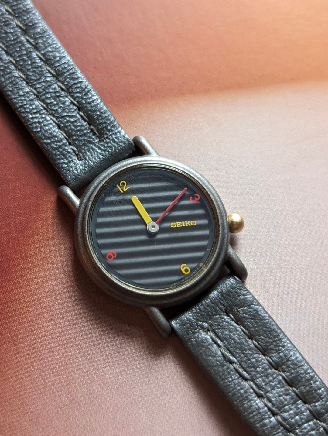 Vintage SEIKO Rivoli Quartz Grey Watch With Red and Yellow Details in ...