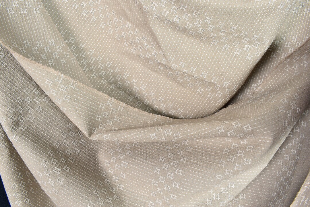 Tela de algodón beige moca con bordado de rayas en relieve en gris ...