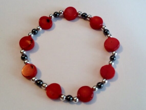 Items similar to Red and Silver Coral Beaded Bracelet on Etsy