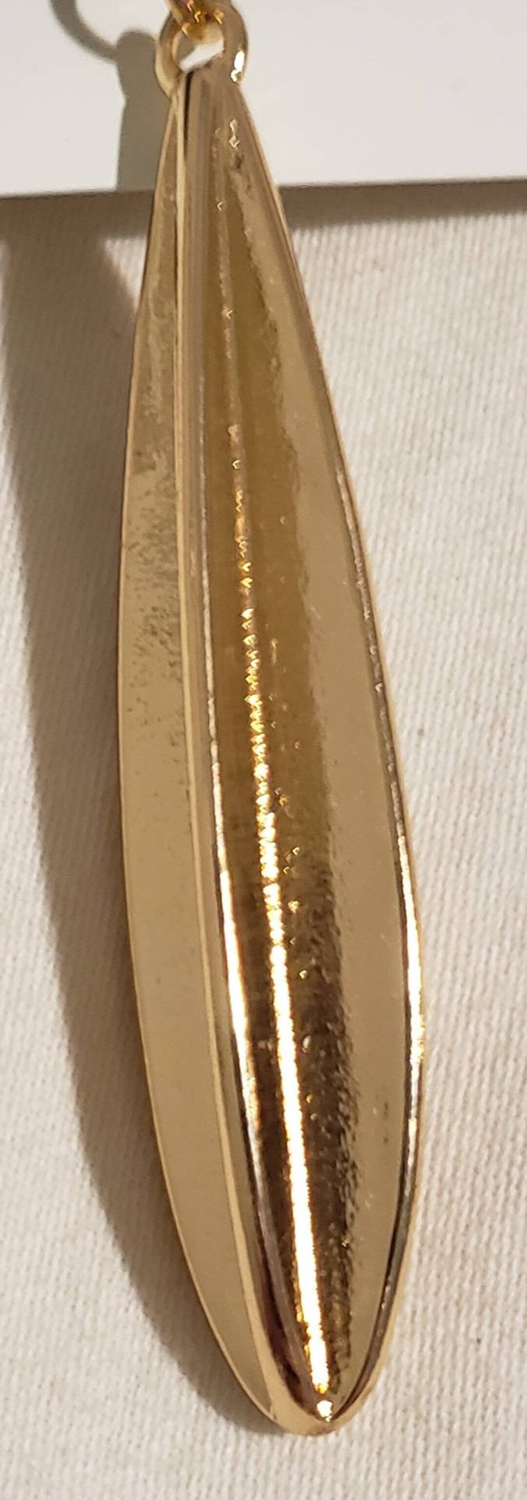 2.5 Inch Long Golden Metal Blimp Looking Abstract Pedant on Black Satin ...