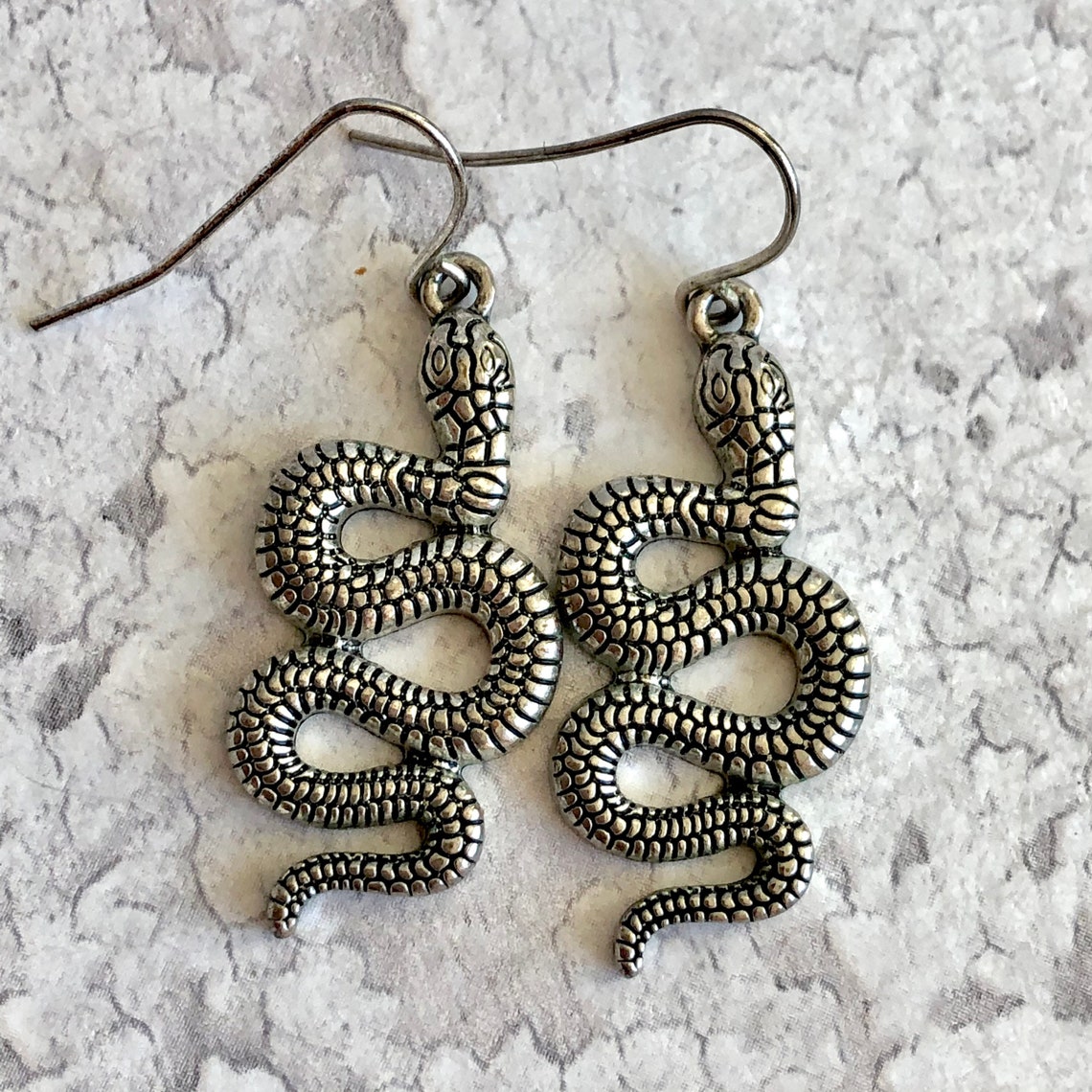 Silver tone snake earrings. | Etsy