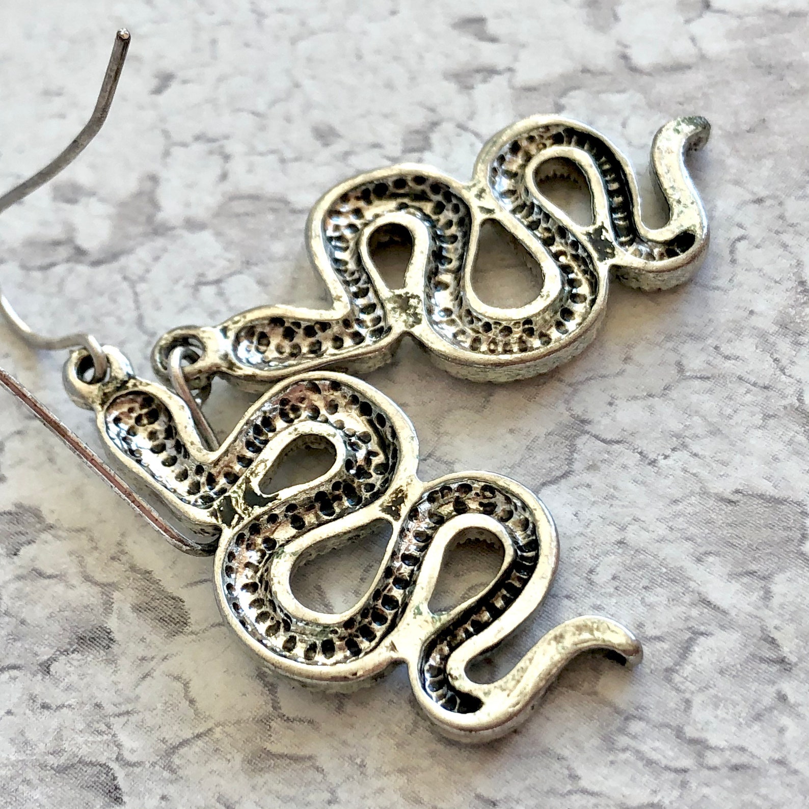 Silver tone snake earrings. | Etsy