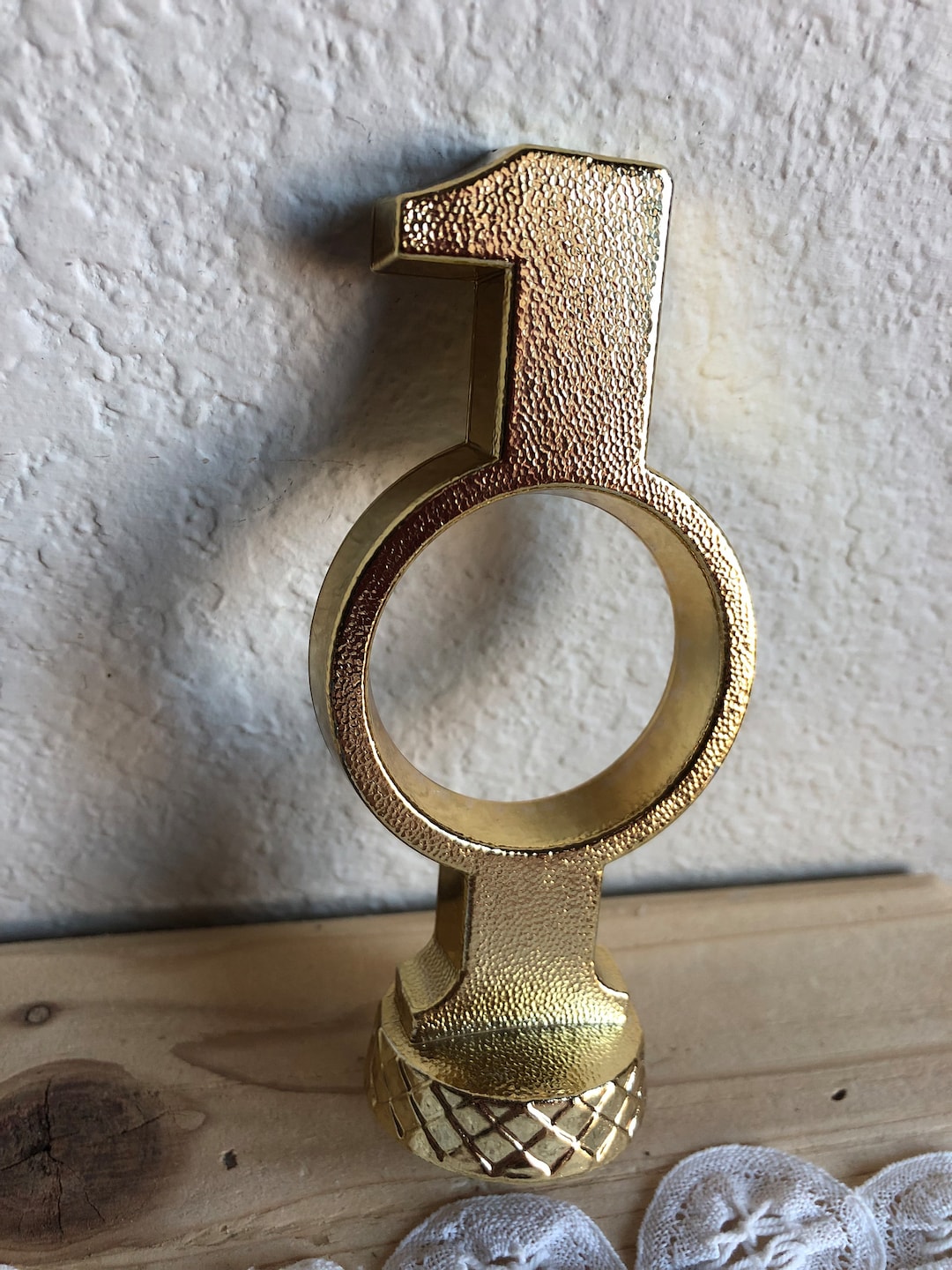 A Gold Tone Shiny Metal Figurine of A Number One With A Hole Taken off ...