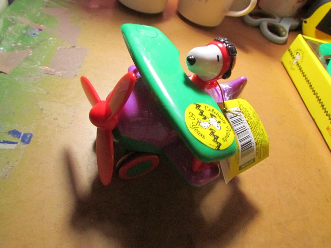 Snoopy Flying Ace Candy Container Bi-plane Peanuts Dog Airplane Purple ...