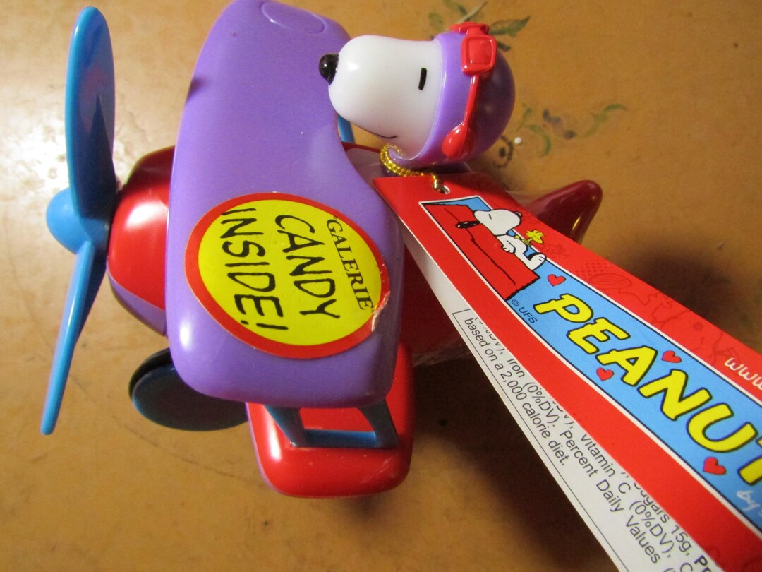 Snoopy Flying Ace Candy Container Bi-plane Peanuts Dog Airplane Purple ...
